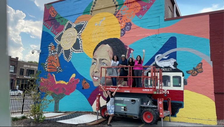The Artist Behind the “Building Bridges” Mural